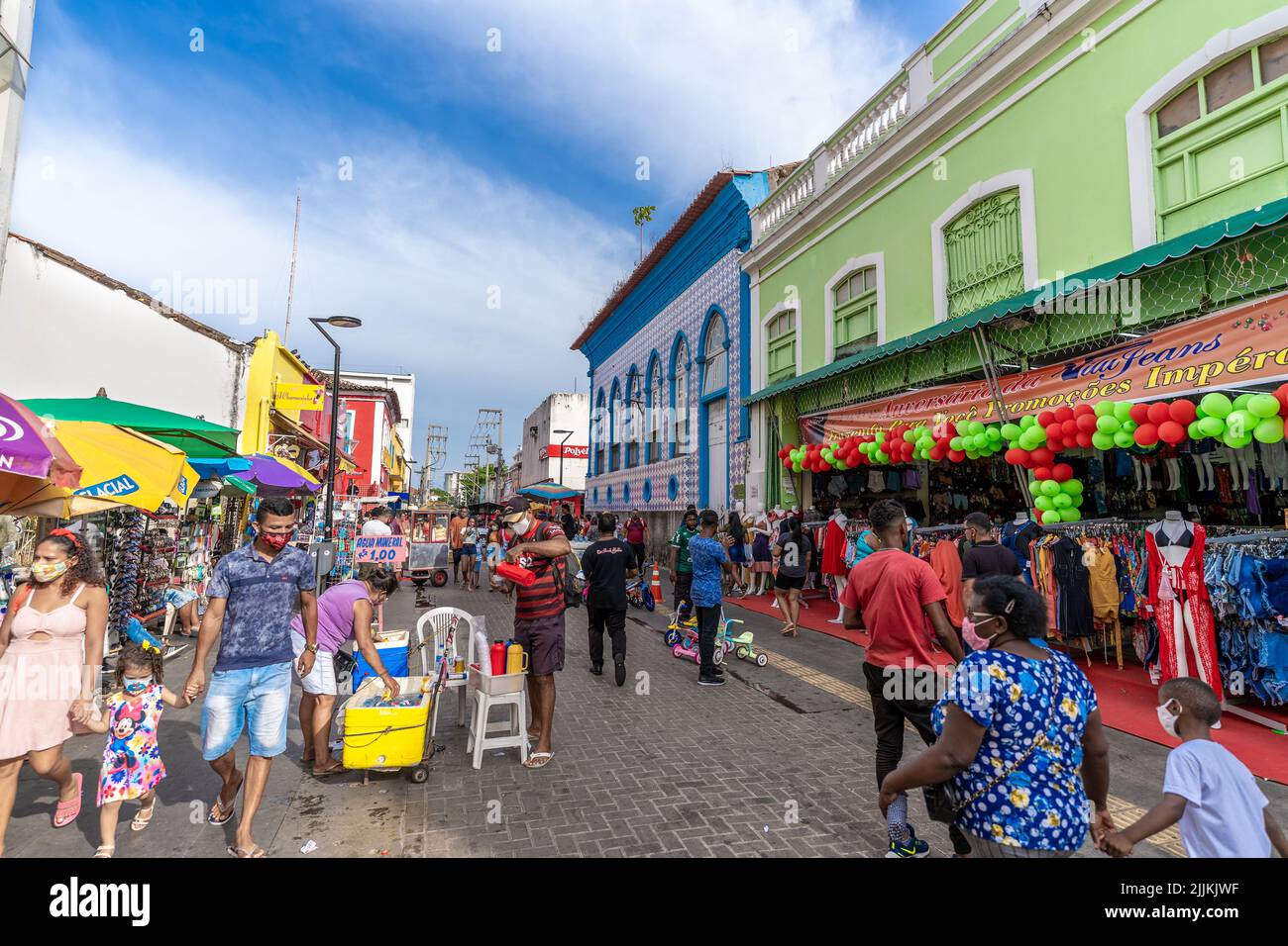 The people walking in the street near the local supermarket in North of ...