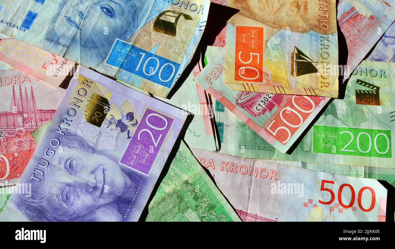 A close-up top shot of many Swedish banknotes in a mess Stock Photo - Alamy