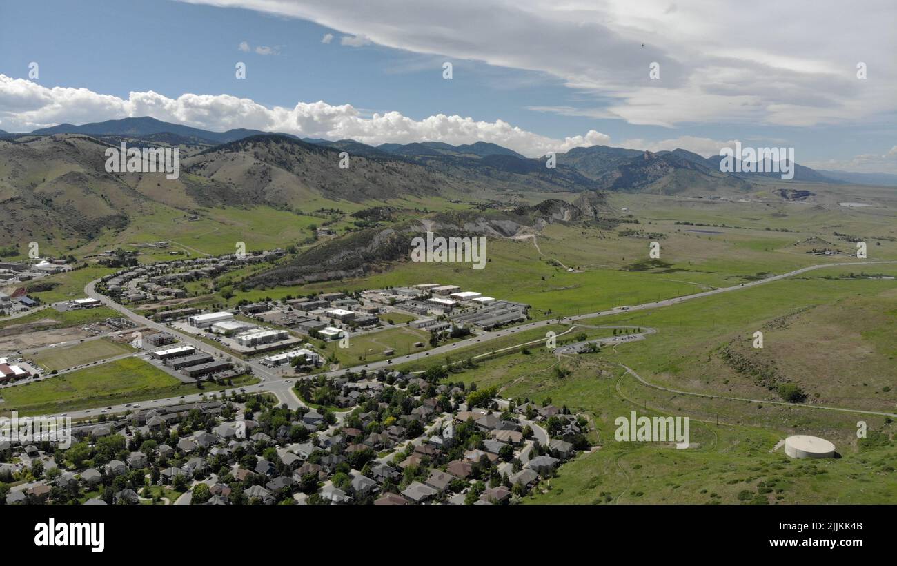 An aerial view of fields and agricultural buildings on the background ...