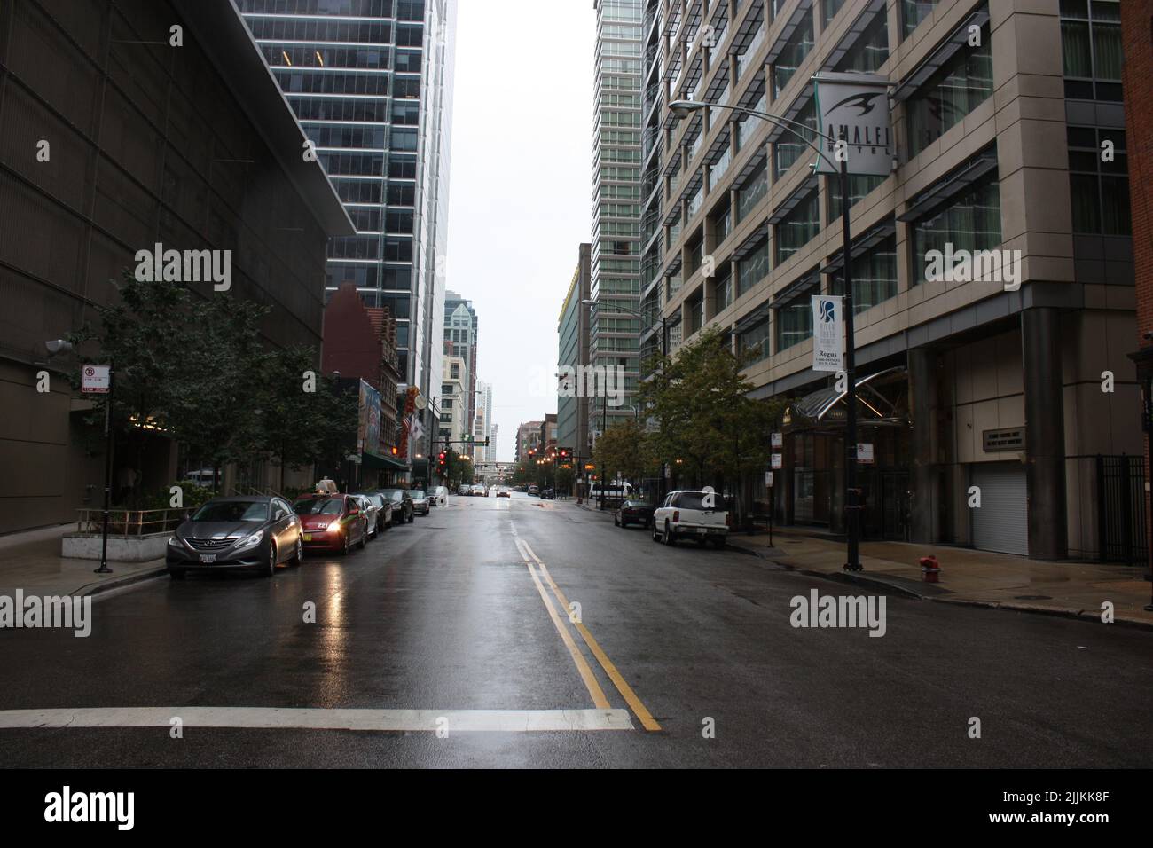 A shot of cars parked against skyscrapers in Chicago, the United States ...
