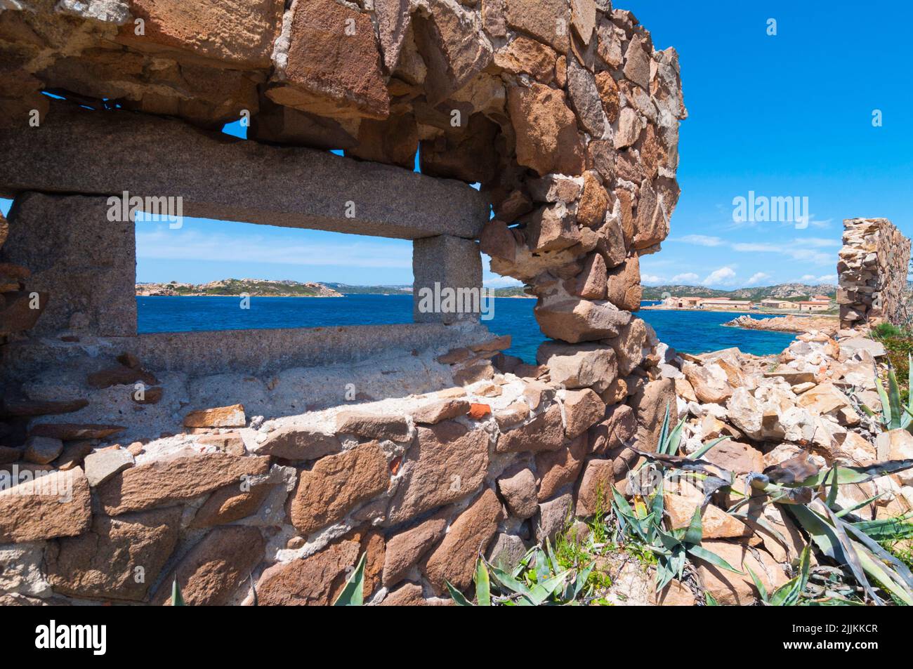 a photo of old stone made house on a seashore Stock Photo - Alamy