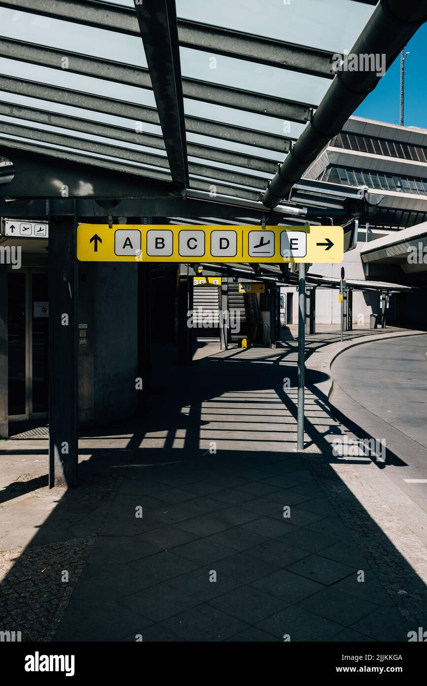 A signboard with symbols showing directions for airport terminals Stock ...