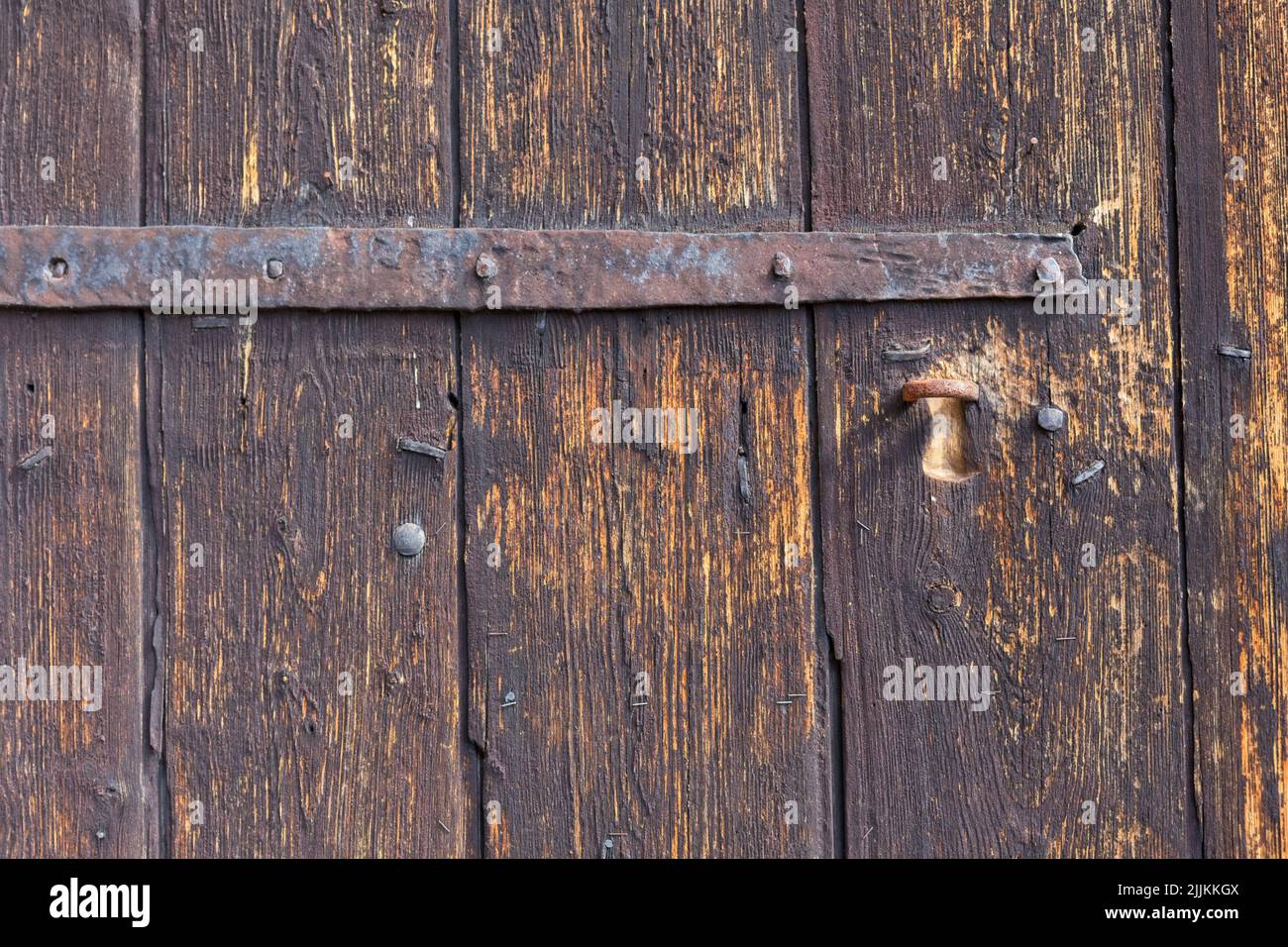 Closeup of a old rusty door hinge on wooden weathered door Stock Photo ...