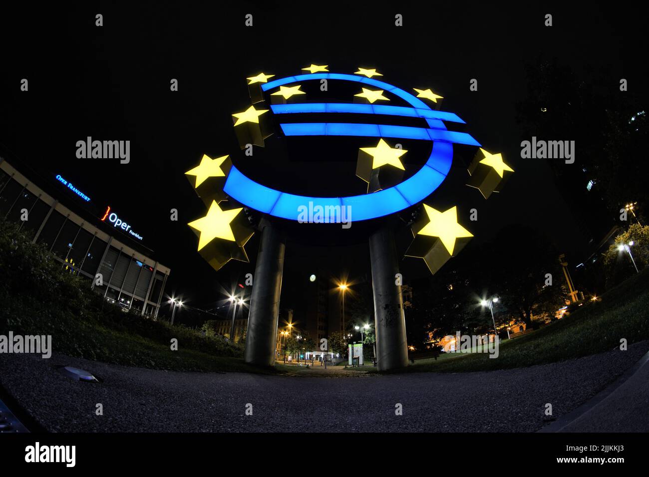 A low angle shot of an illuminated big Euro sign at night in Frankfurt ...