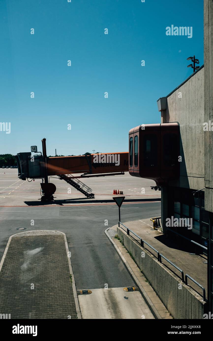 A long pull-out gangway from gate to plane at the airport Stock Photo ...