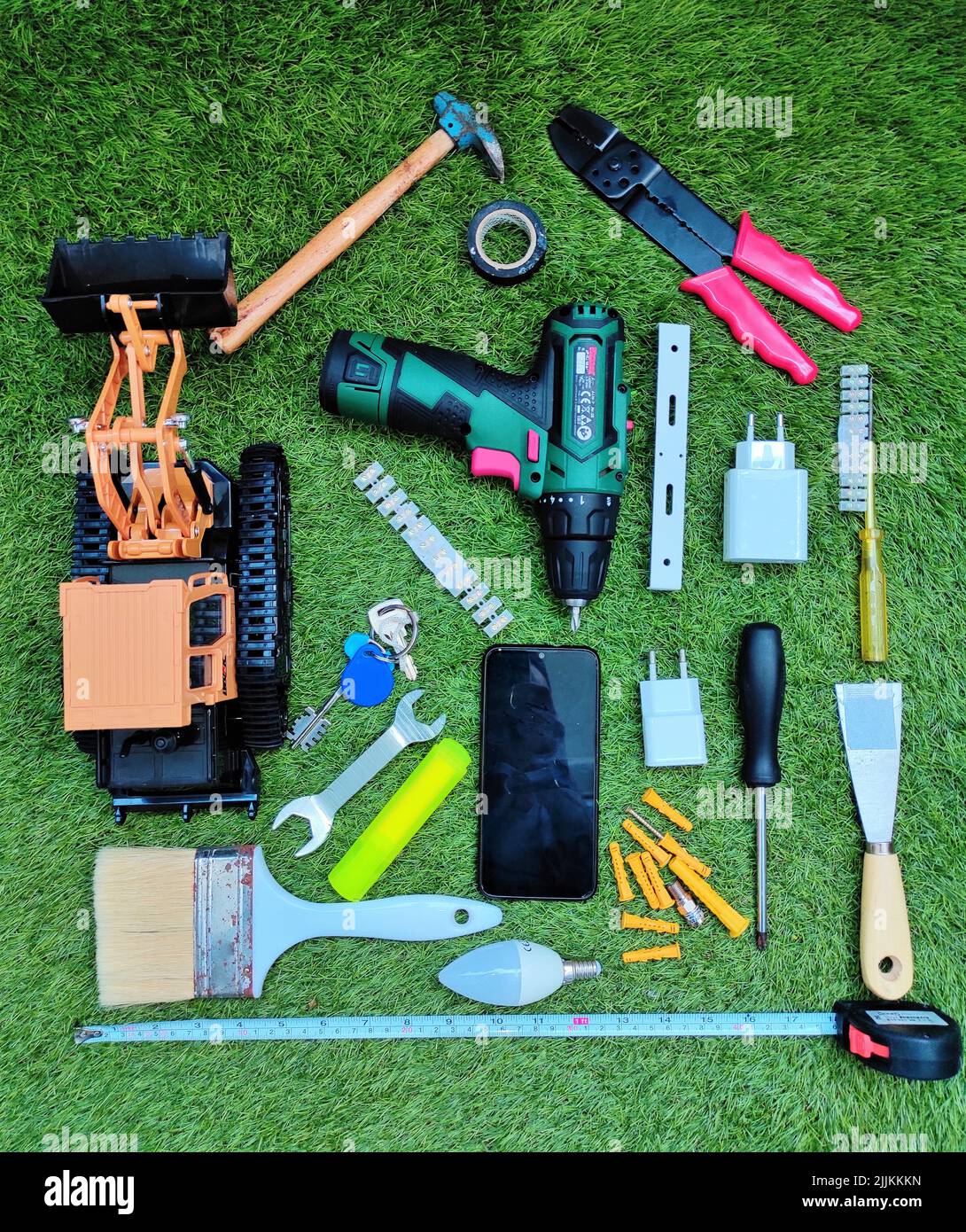 A top view of different tools on the green grass Stock Photo - Alamy