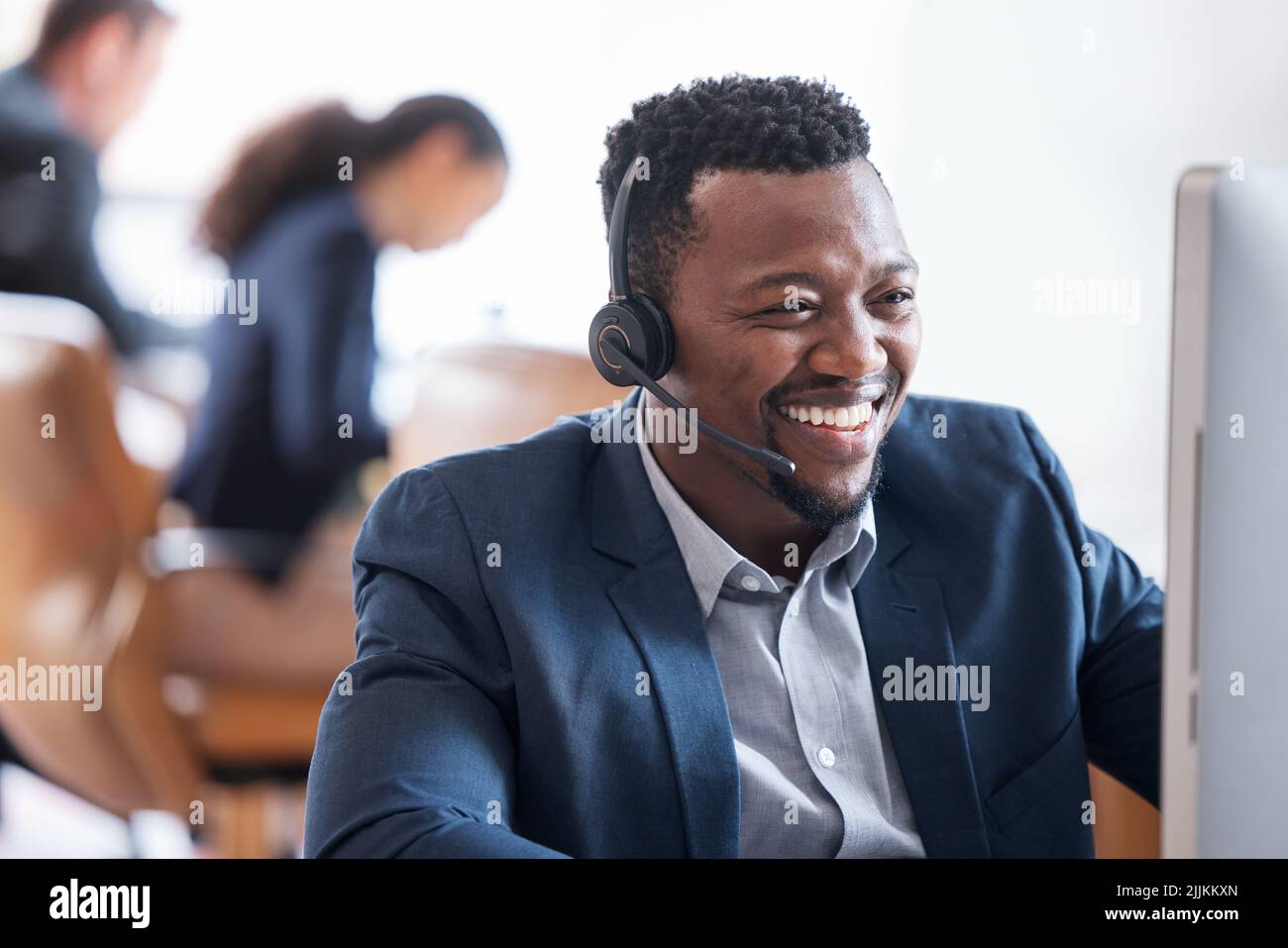 Hes happy to help. a handsome young male call center agent working at ...