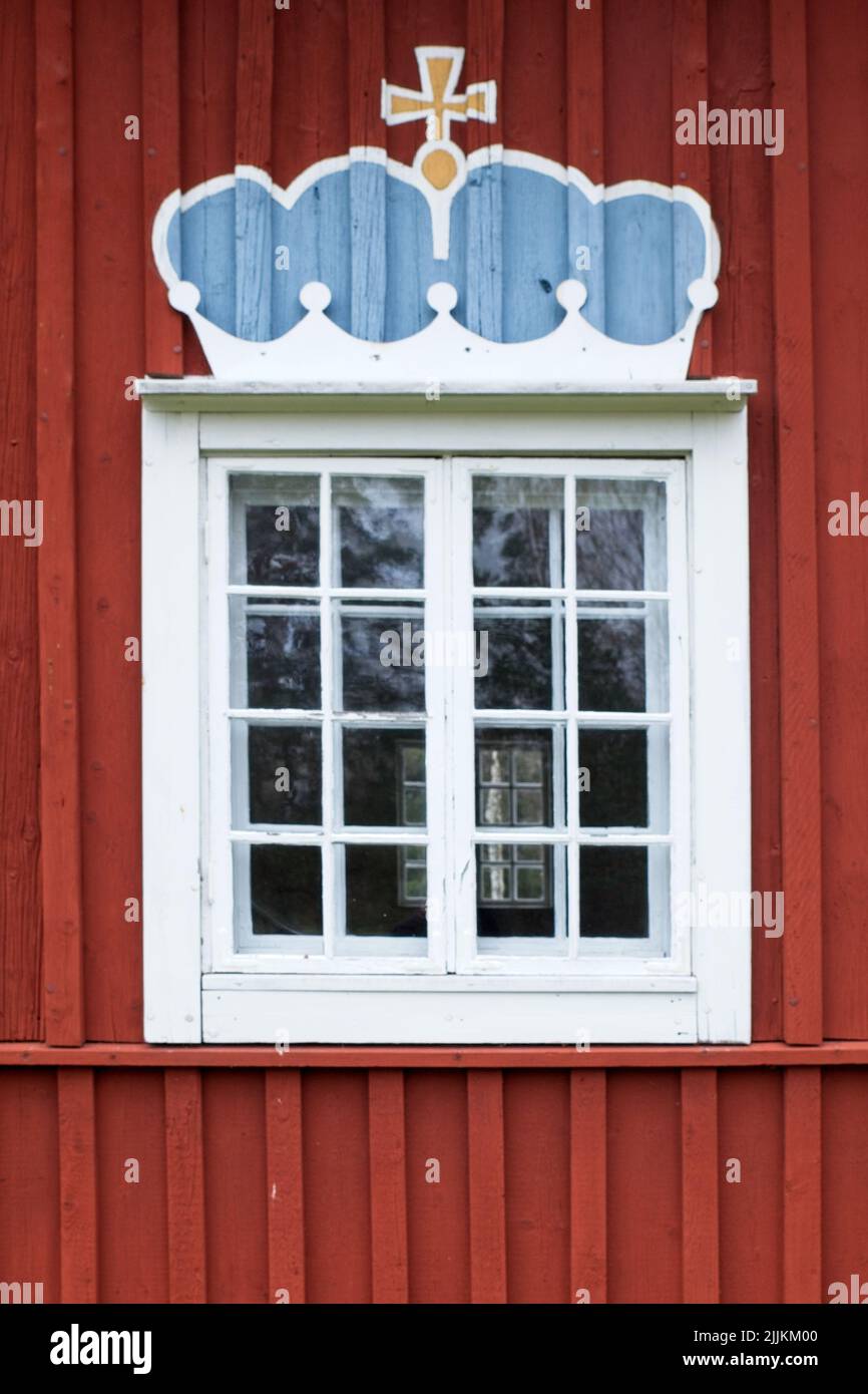 Decorative wood framed window on a old red wood building Stock Photo ...