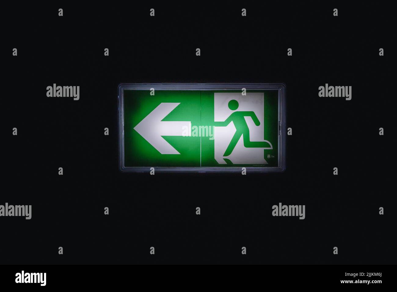 Emergency sign with light in a dark corridor Stock Photo - Alamy