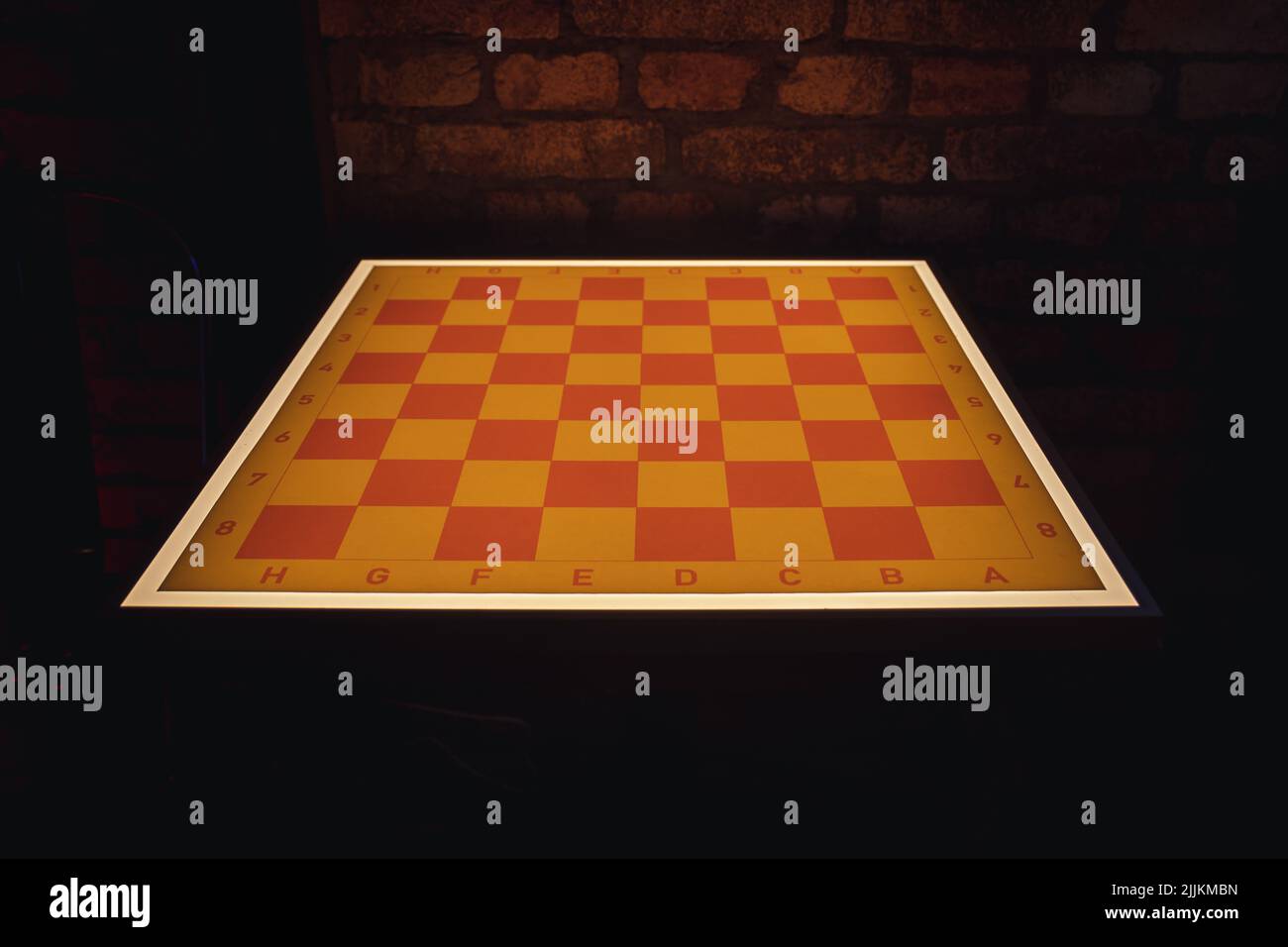 Close up on a modern chess board with light Stock Photo - Alamy