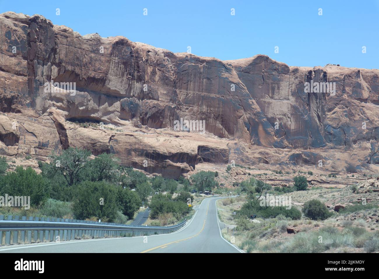 A roadway through a landscape of rocks near Moab in Utah, the United ...