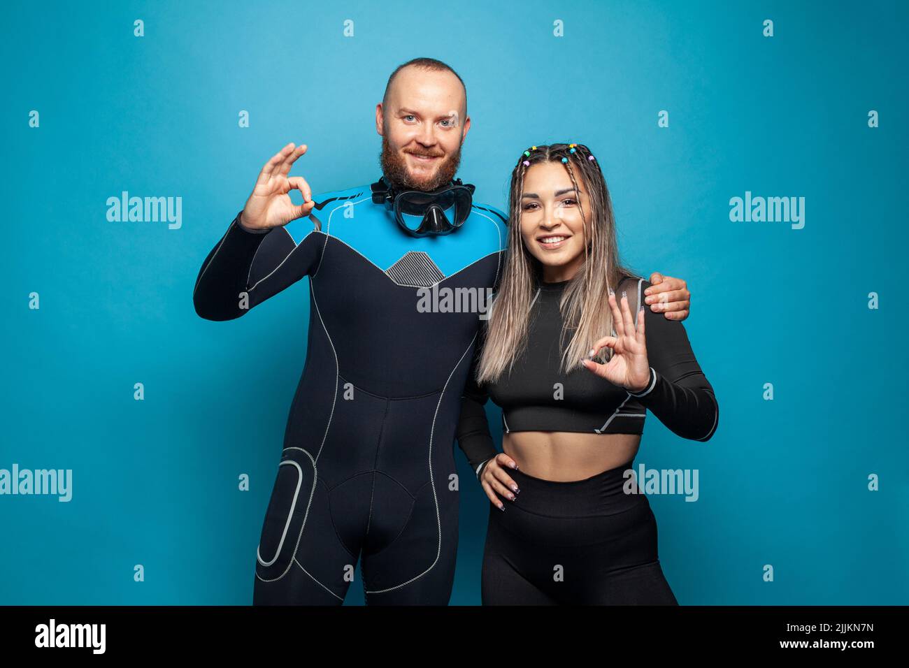 Happy sports people. Sport, fitness and diving concept Stock Photo - Alamy