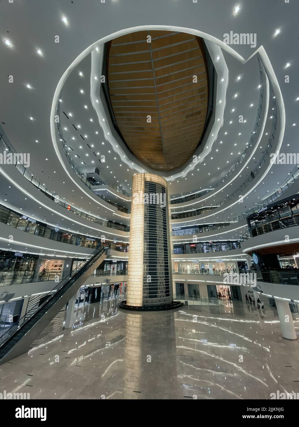 The vertical wide-angle shot of the interior of the mall building ...