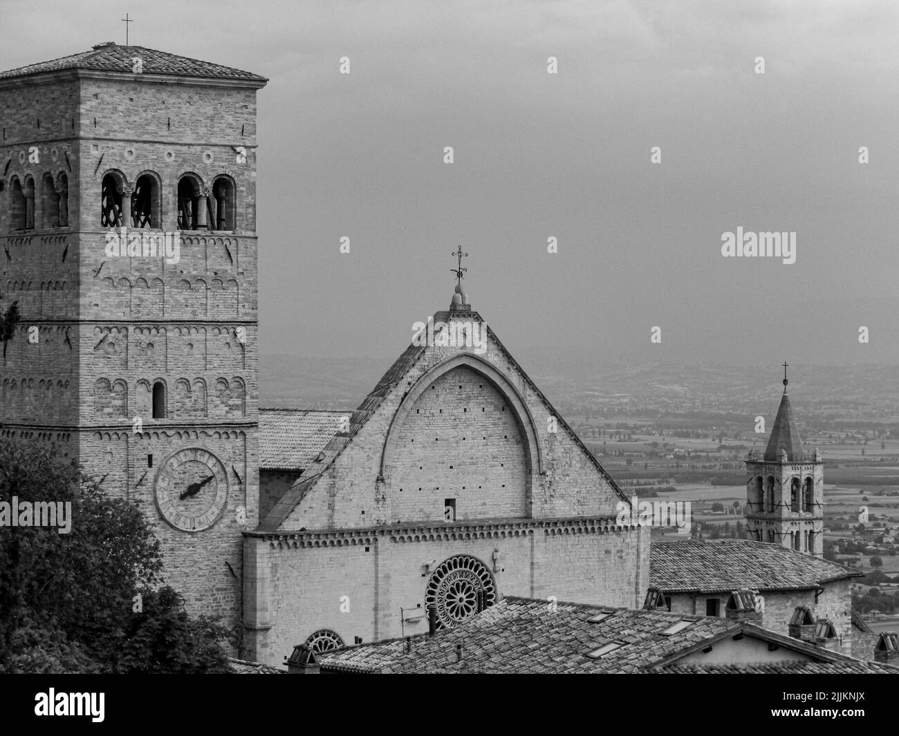 A grayscale shot of Churches in the historic center of Assisi, Italy ...