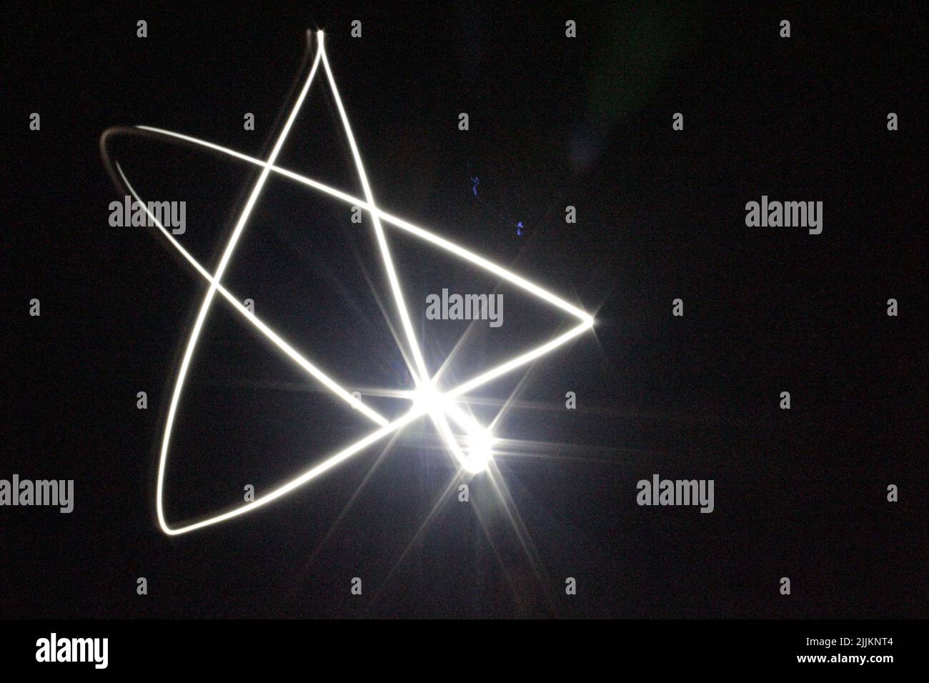 fluorescent light star design in a black background Stock Photo - Alamy