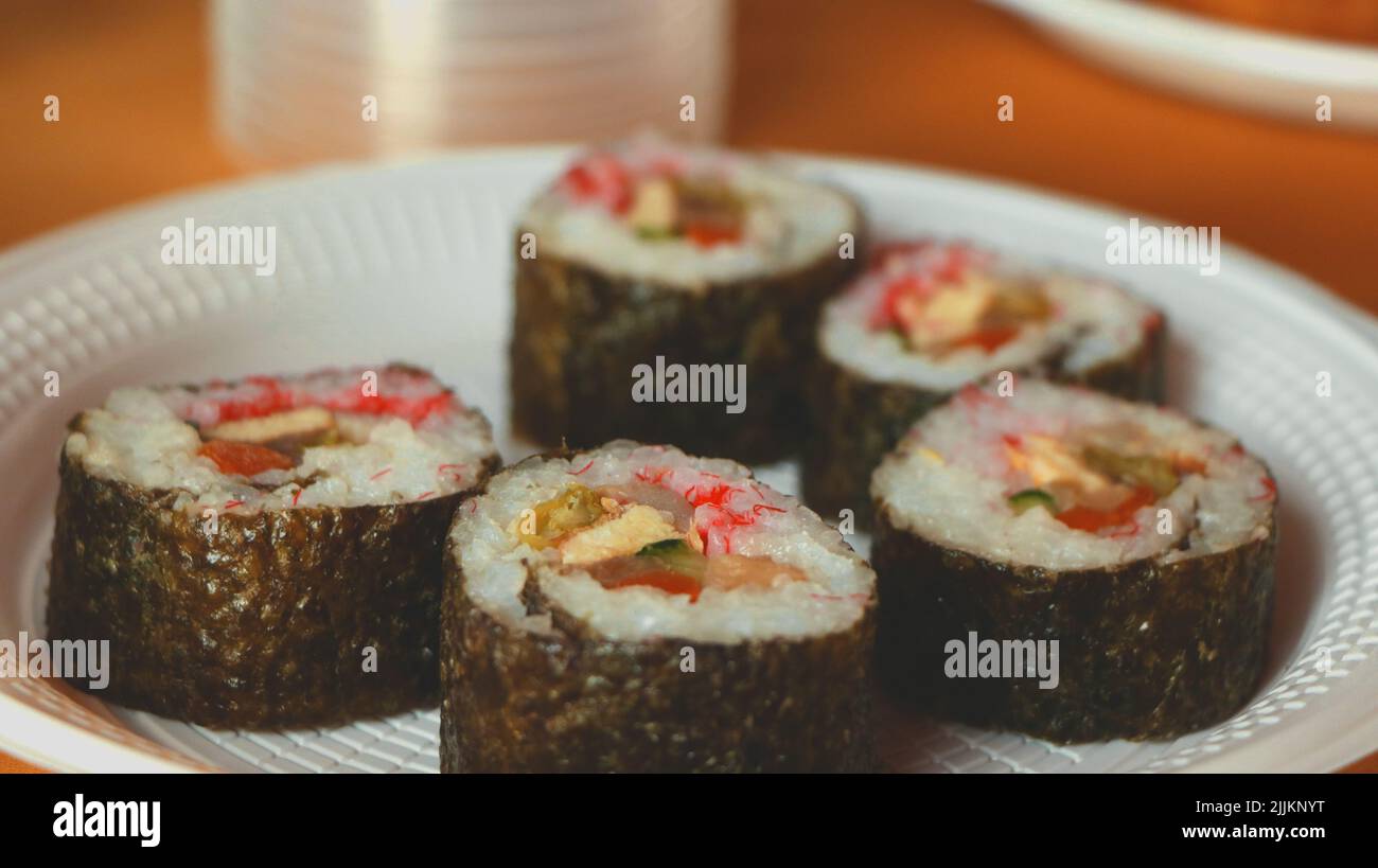 plate with sushi made of rice and nori Stock Photo - Alamy