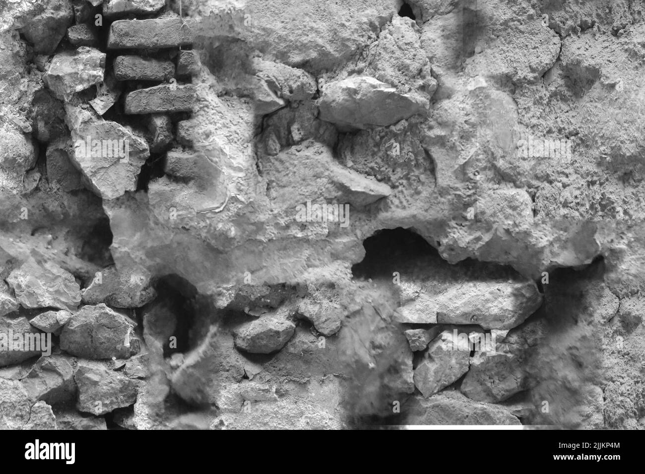 A closeup shot of details on a textured broken gray stone surface Stock ...