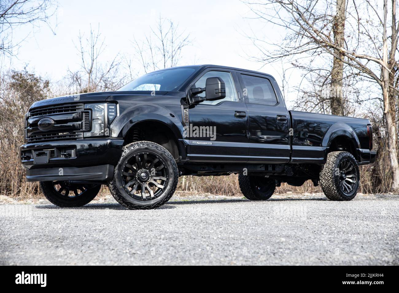 A black Ford pickup truck parked outside Stock Photo - Alamy