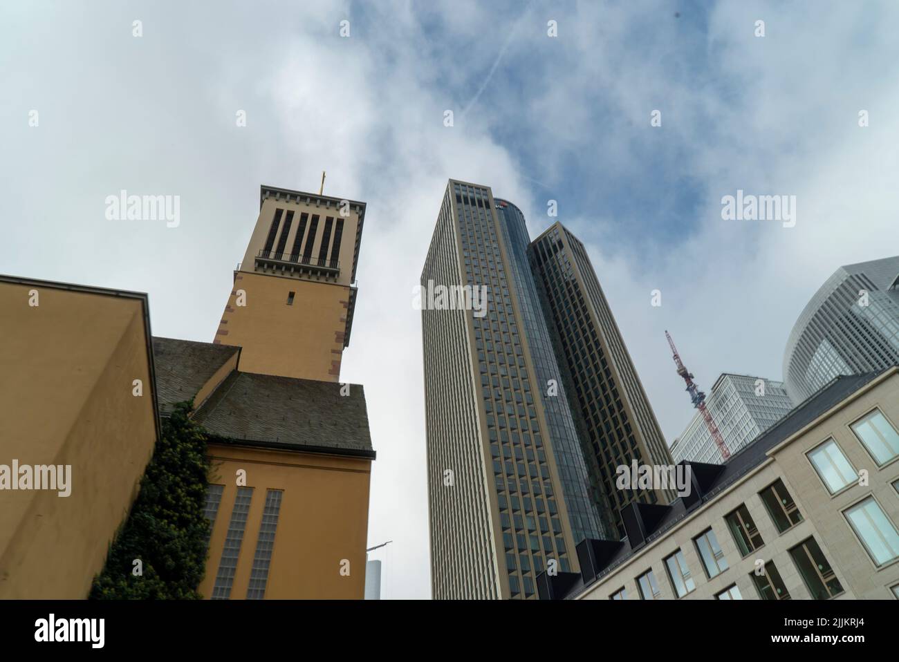 A low angle shot of tall modern buildings in downtown Frankfurt ...