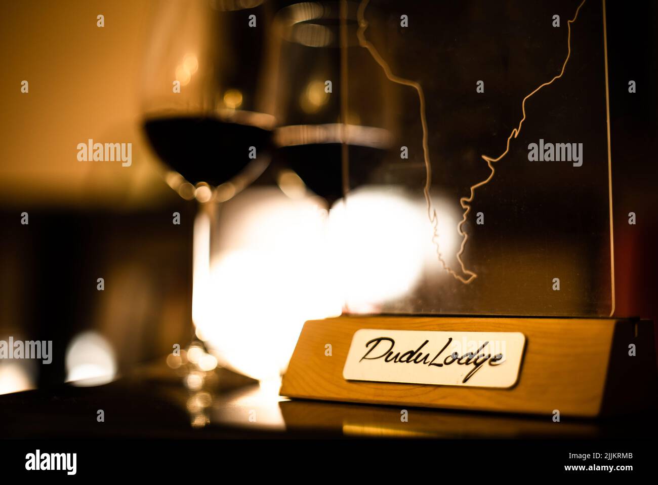 A closeup of an inscription "Dudu Lodge" with South America's outlined ...