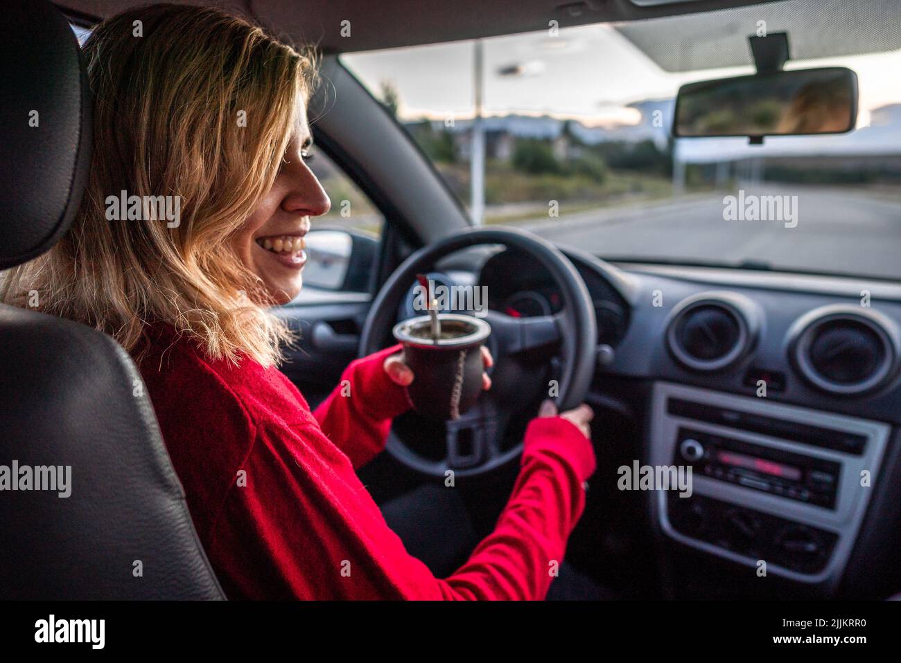 Laughing blond woman sitting hi-res stock photography and images - Alamy