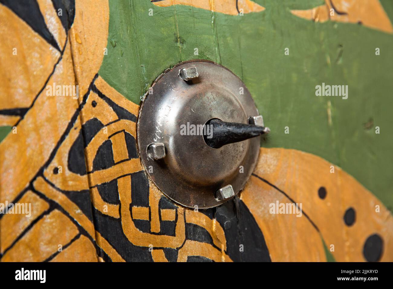 A close-up shot of a colorful shield with a sharp metal part Stock ...