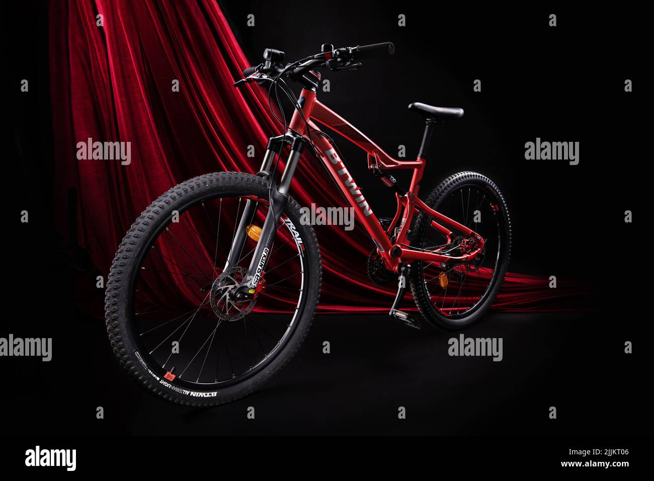 A red mountain bike product photography in a black studio with a red ...