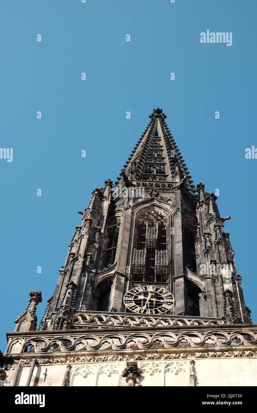 A vertical low angle shot of St Lambert's Church tower. Munster ...