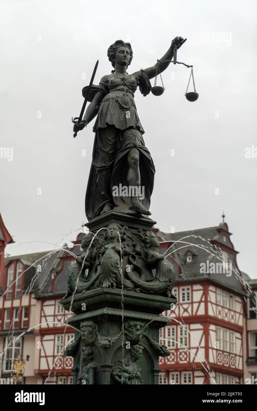 A vertical shot of the Themis's statue Stock Photo - Alamy