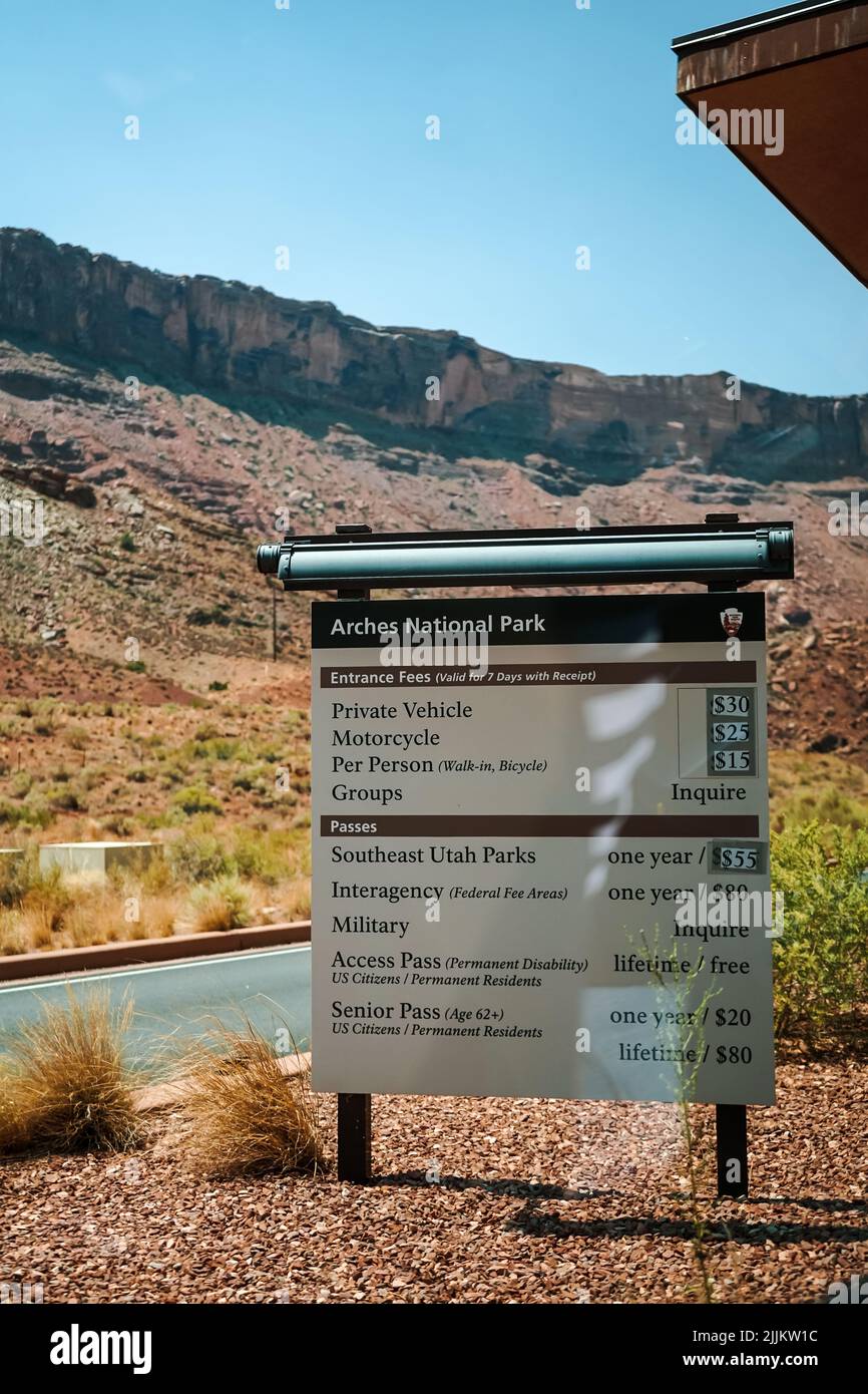 A vertical shot of an entry sign showing the prices at the entry of ...