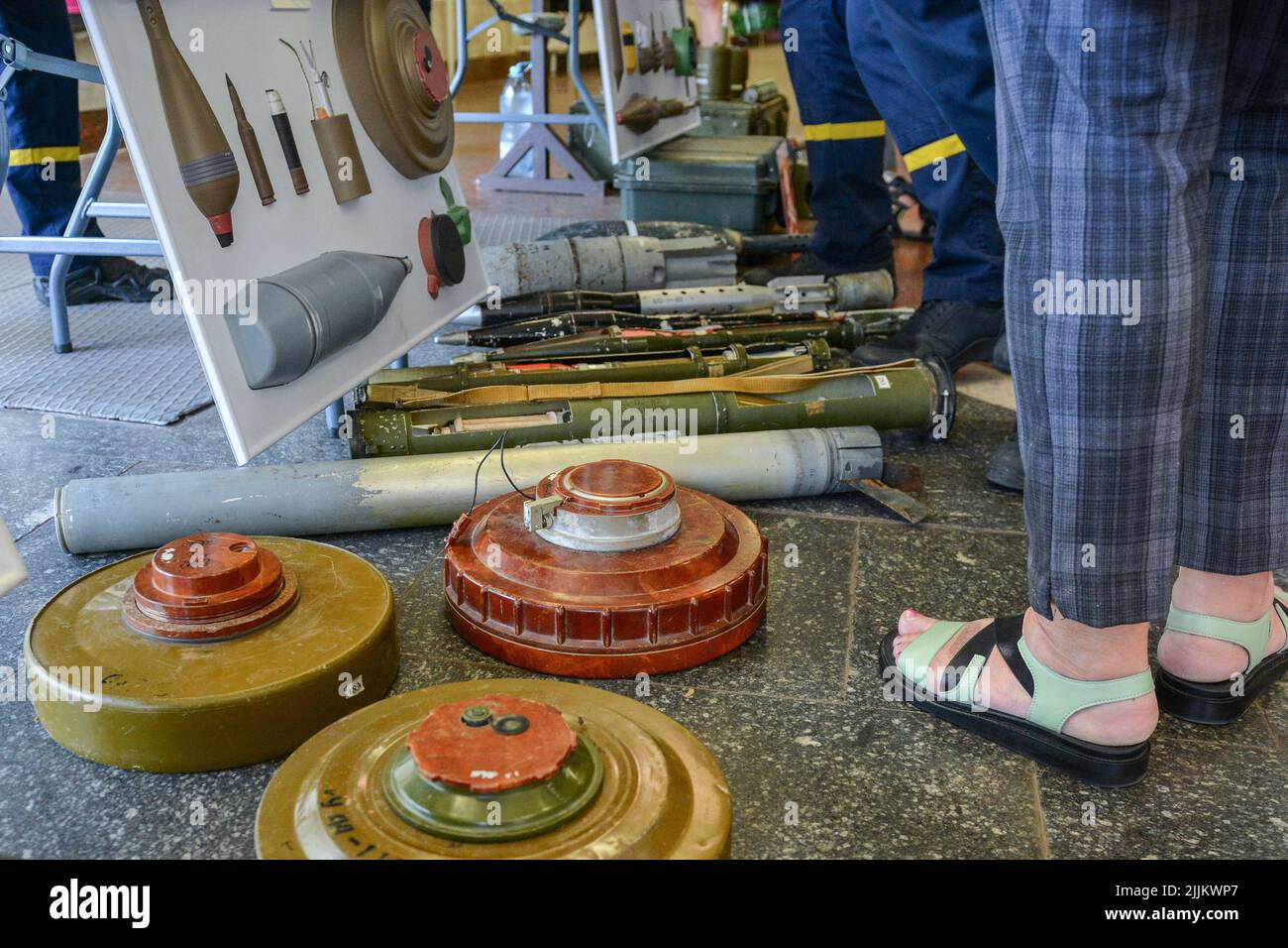 Demined Russian shells and anti-tank mines during a safety briefing ...