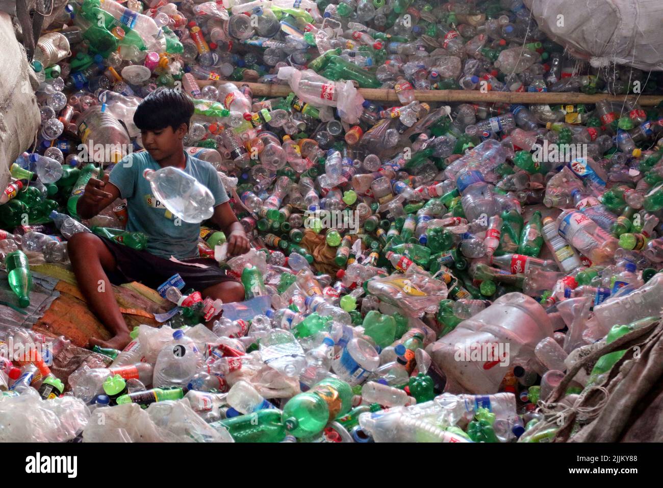Works Work in a plastic bottle recycling factory in Dhaka, Bangladesh ...