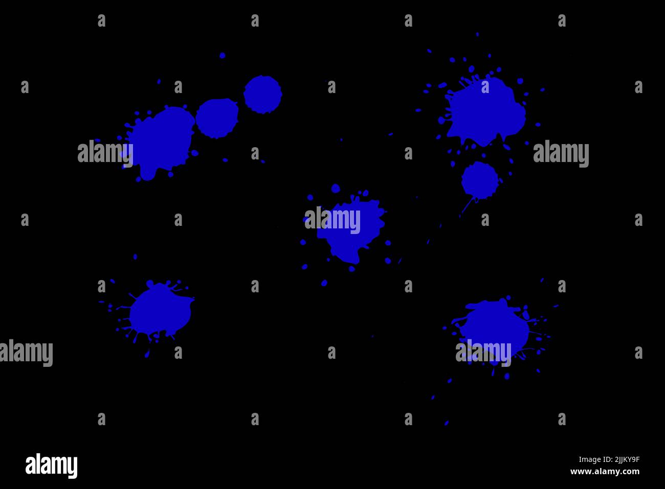 A blue blot on a black background - Spots of paint on a piece of paper ...