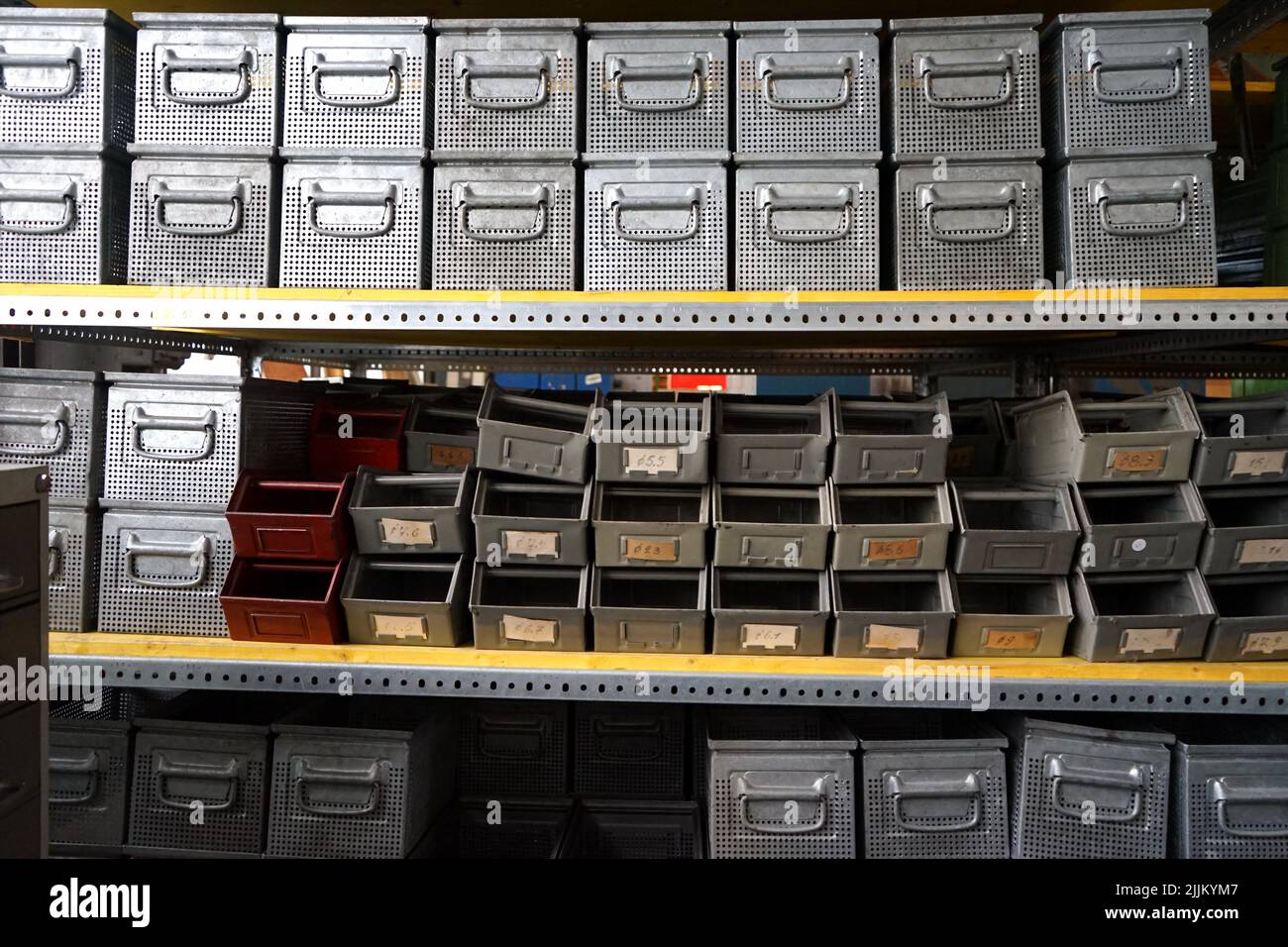 A view of shelves full of metal containers Stock Photo - Alamy