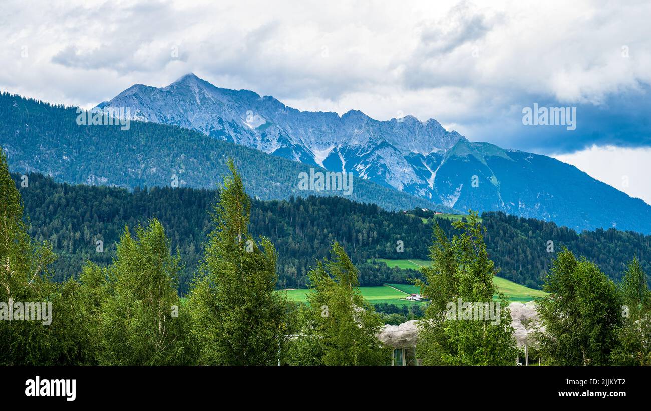 A beautiful landscape view of the Austrian alps against cloudy sky ...