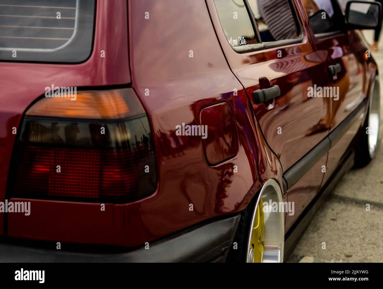 A closeup shot of a red VW low rider Golf Stock Photo - Alamy