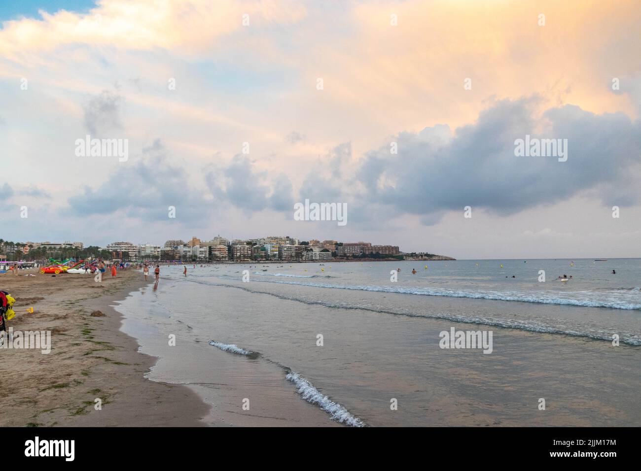 The beach in the city of Salou, Spain at sunset Stock Photo - Alamy