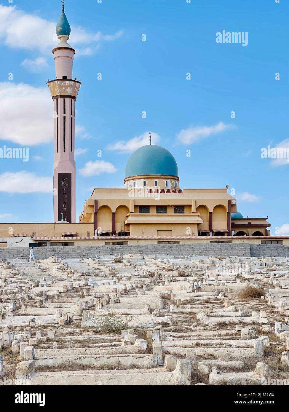 A vertical shot of a mosque on cloudy sky background Stock Photo - Alamy