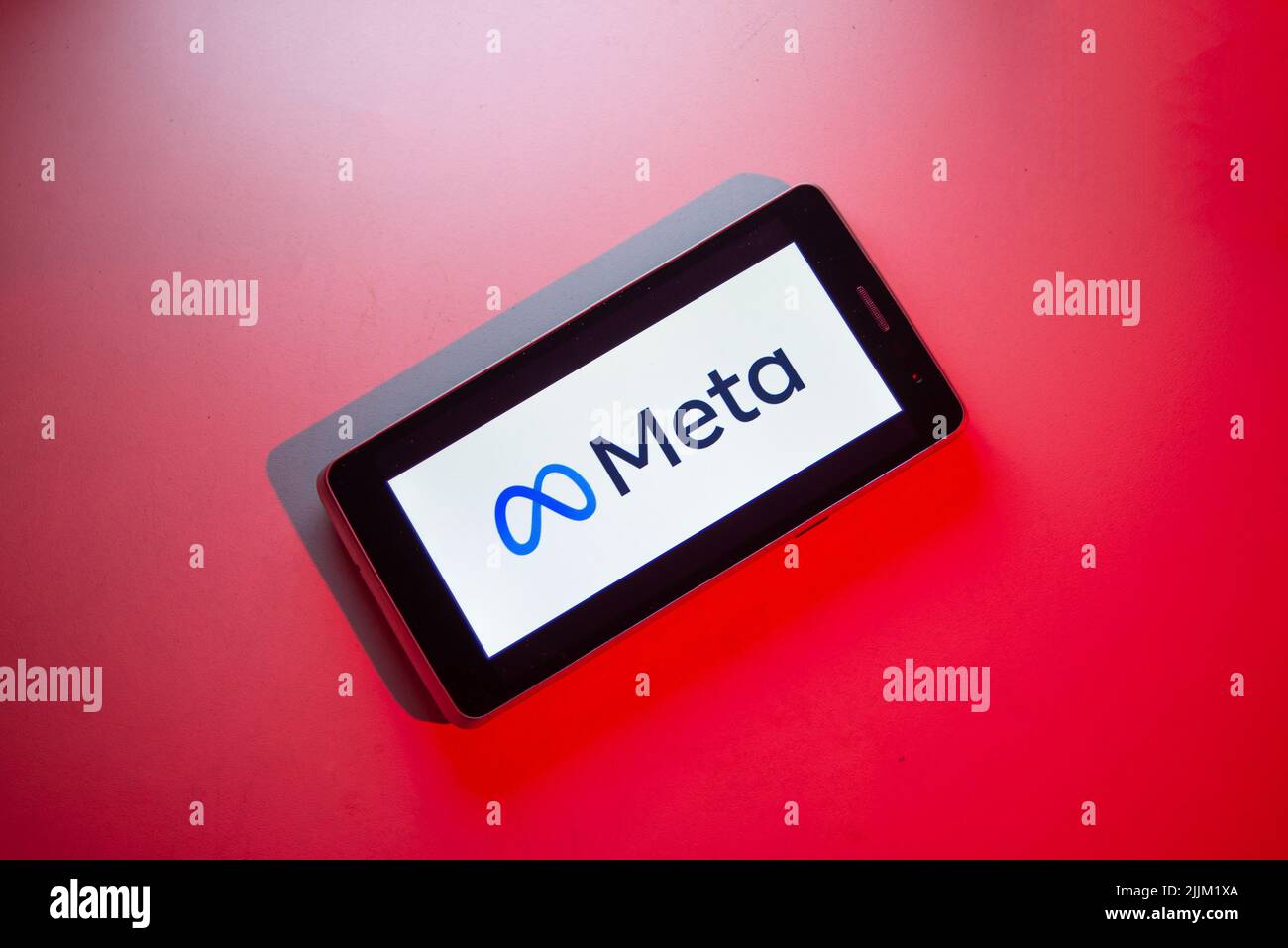 A Meta and Facebook rebranding to new name and logo on a mobile phone ...