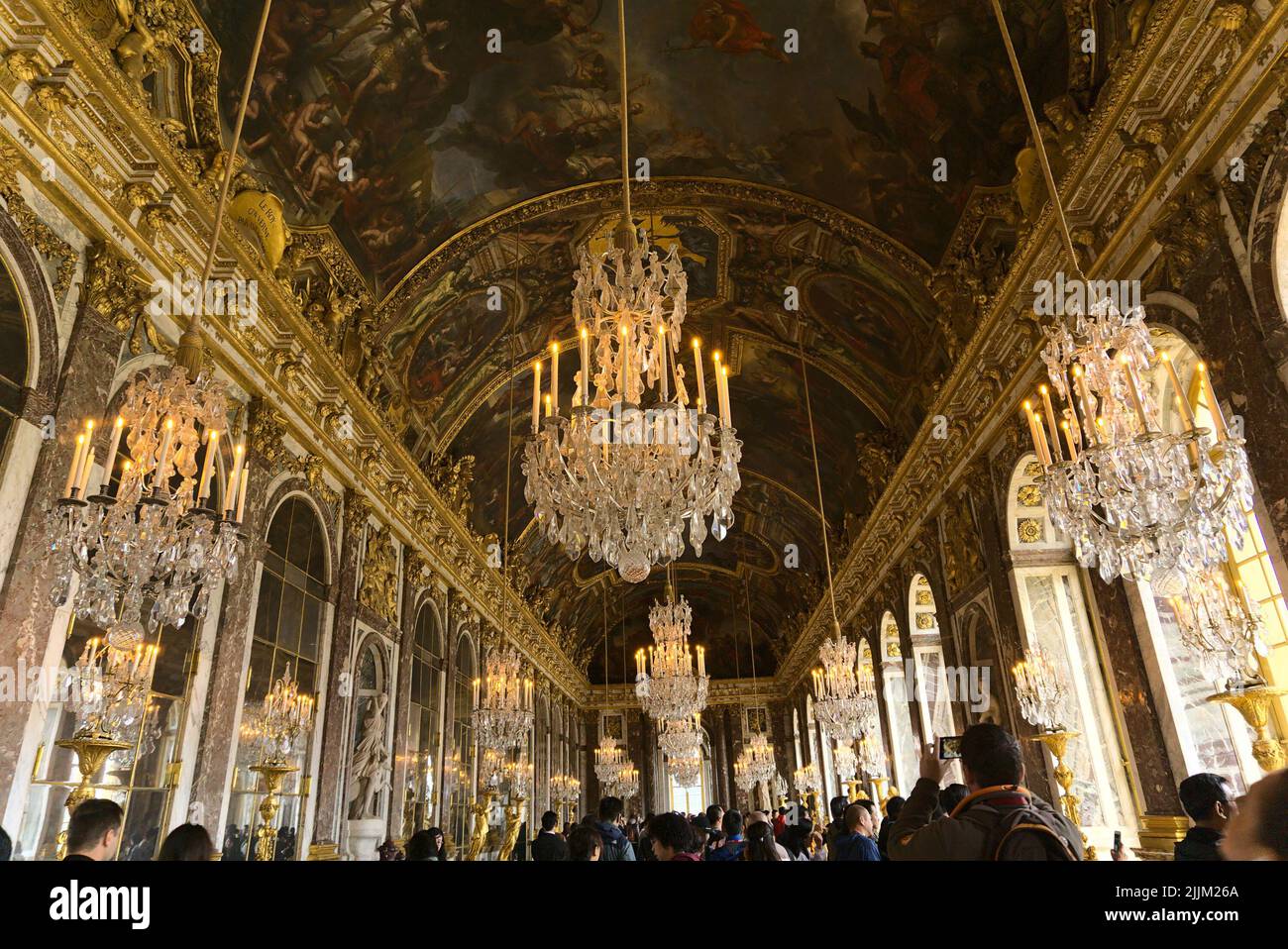 A low angle shot of the ceiling chandeliers in Hall of Mirrors, Palace ...