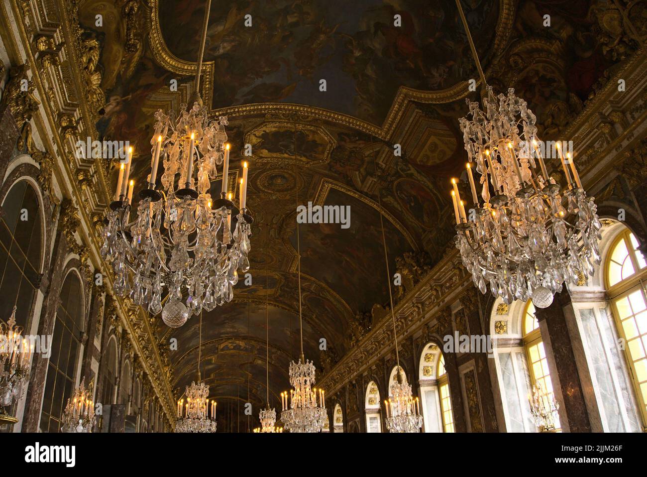 The low angle shot of the Hall of Mirrors, Palace of Versailles, Paris ...
