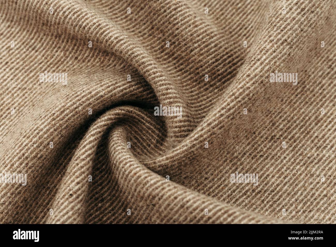 Texture of twisted dense material of brown color. Piece of fabric with ...