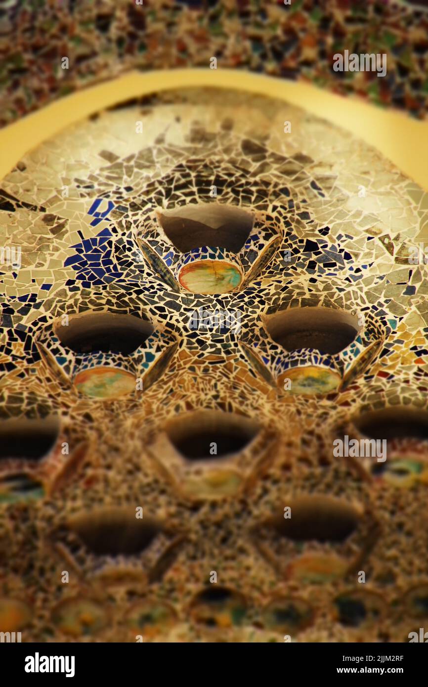A vertical closeup shot of a mosaic design on architecture in Barcelona ...
