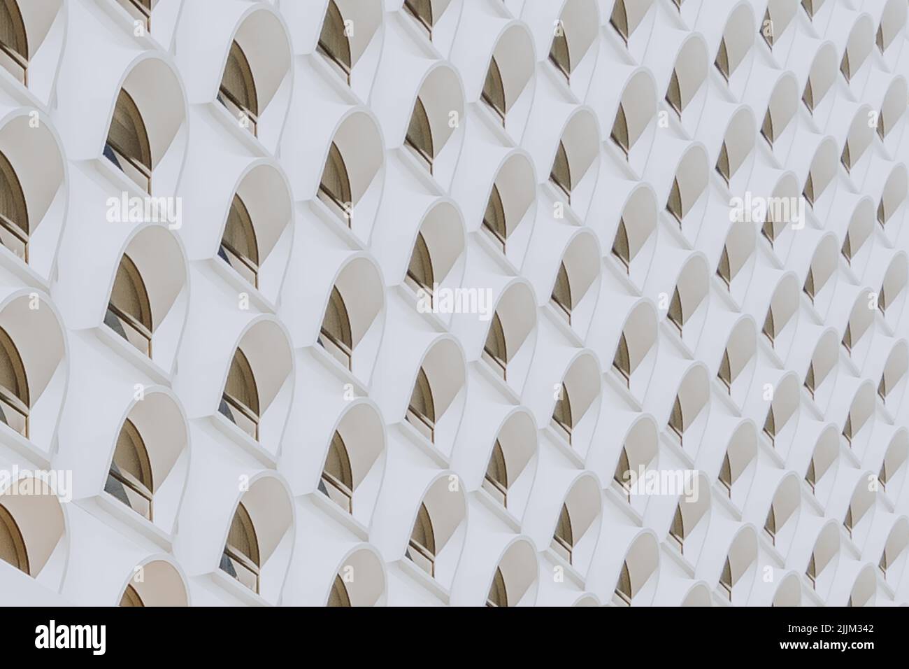 A closeup of a white building with modern windows Stock Photo - Alamy