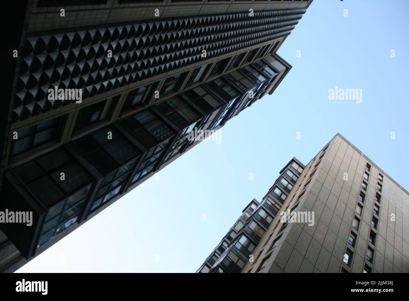 A low angle shot of modern building under the clear skies Stock Photo ...