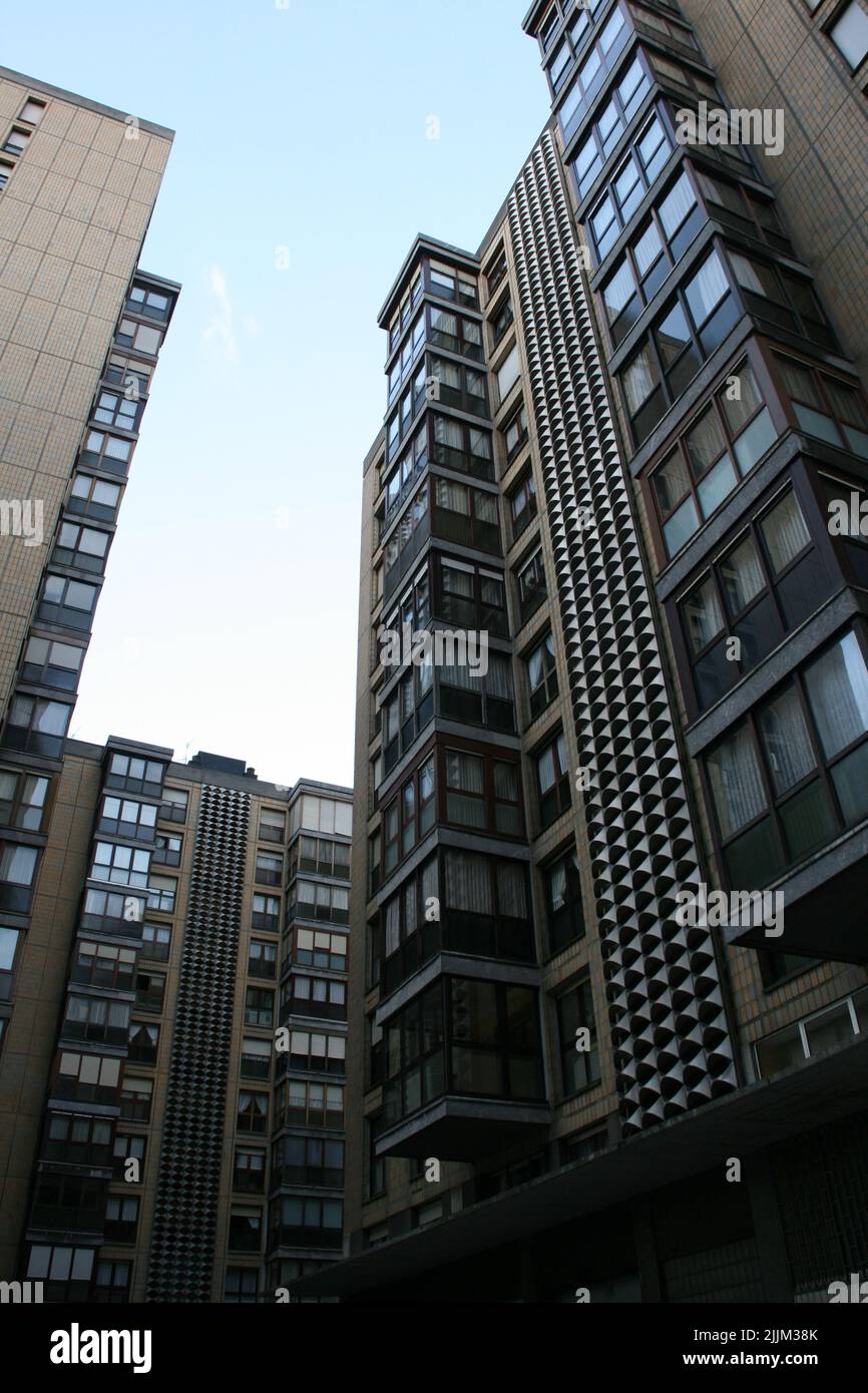 A vertical low angle shot of high rise residential buildings in Bilbao ...