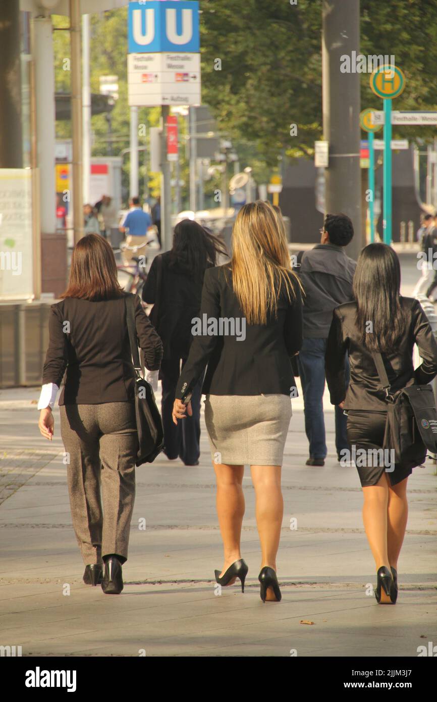 Female group walking urban park hi-res stock photography and images - Alamy