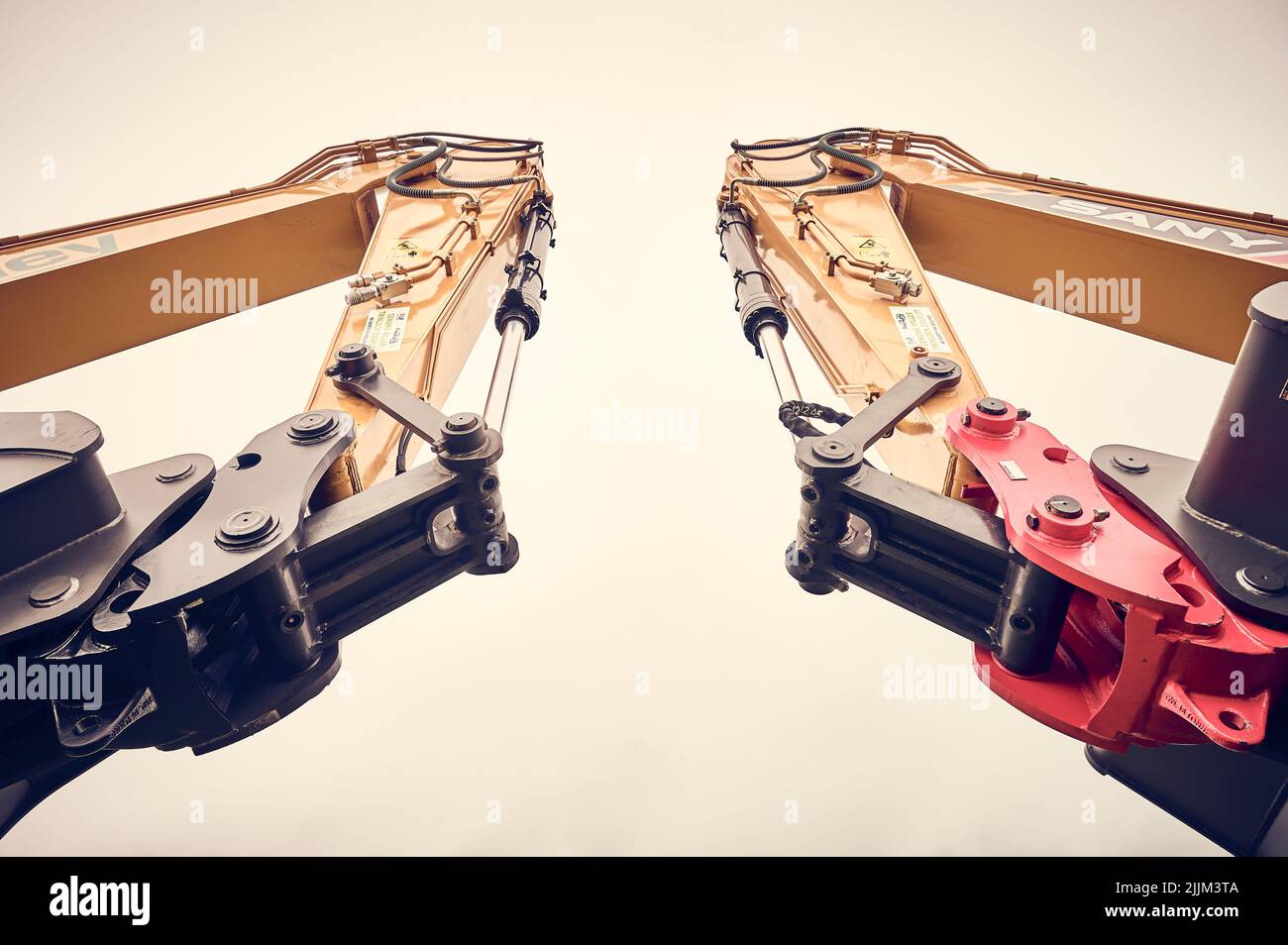The mechanical arms of two Sany digger excavators against sky Stock ...