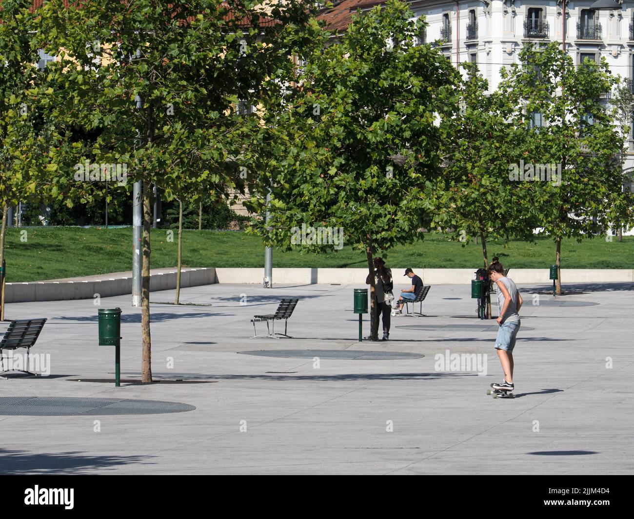 A skater in a park at noon Stock Photo - Alamy