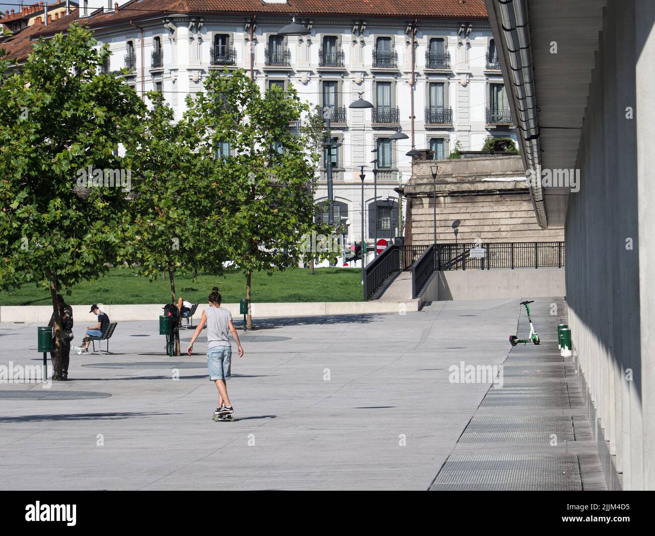 A skater in a park at noon Stock Photo - Alamy